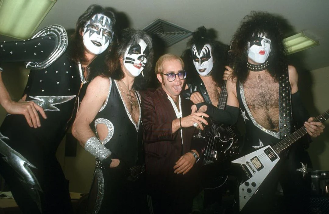 Elton John poses with "Kiss" - circa 1977 in Los Angeles, California | Scrolller