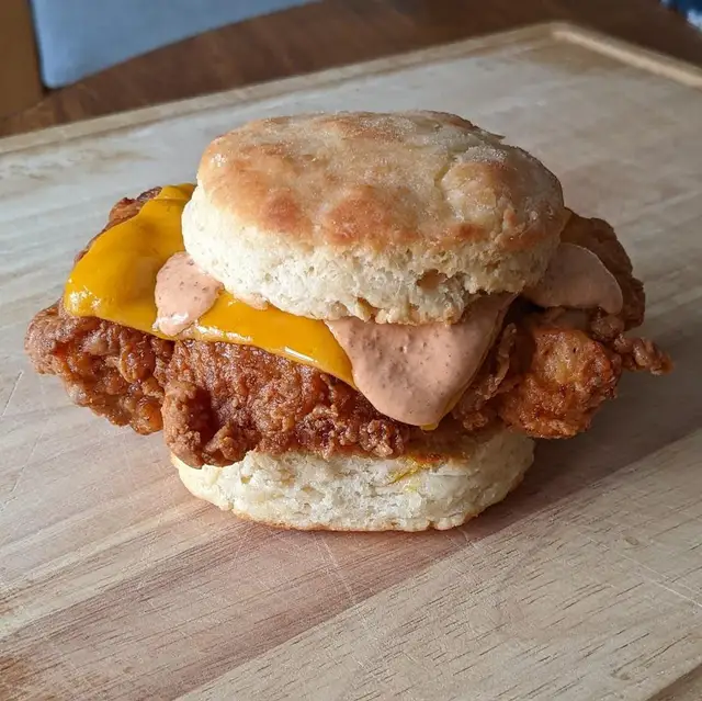 Crispy fried chicken thigh, melted cheddar and chipotle sauce on a buttermilk biscuit. | Scrolller