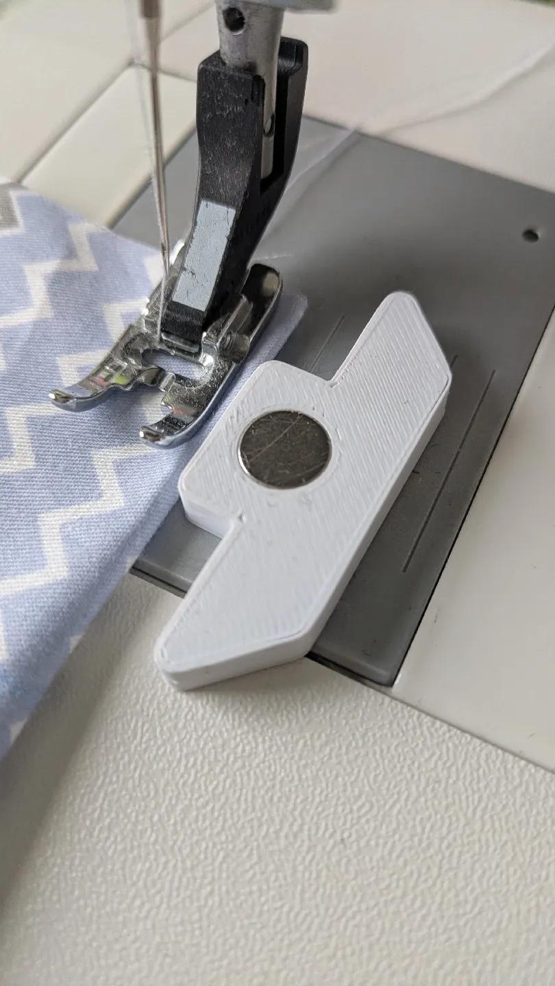 My wife designed and printed a seam guide for her sewing machine that attaches with a magnet ...