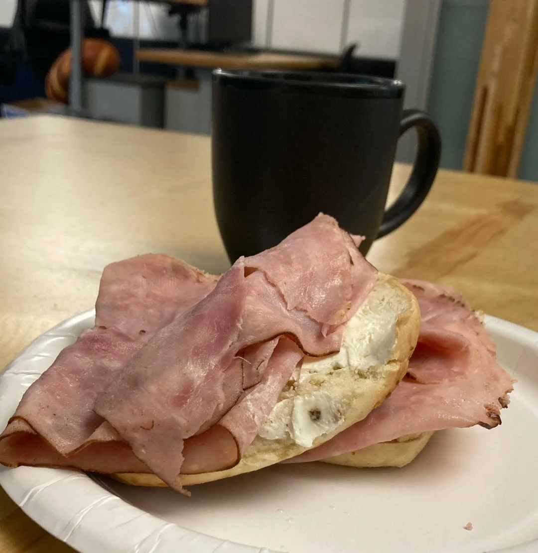 My poor man’s Bagel and lox. Toasted onion bagel with cream cheese and Black Forest ham open ...