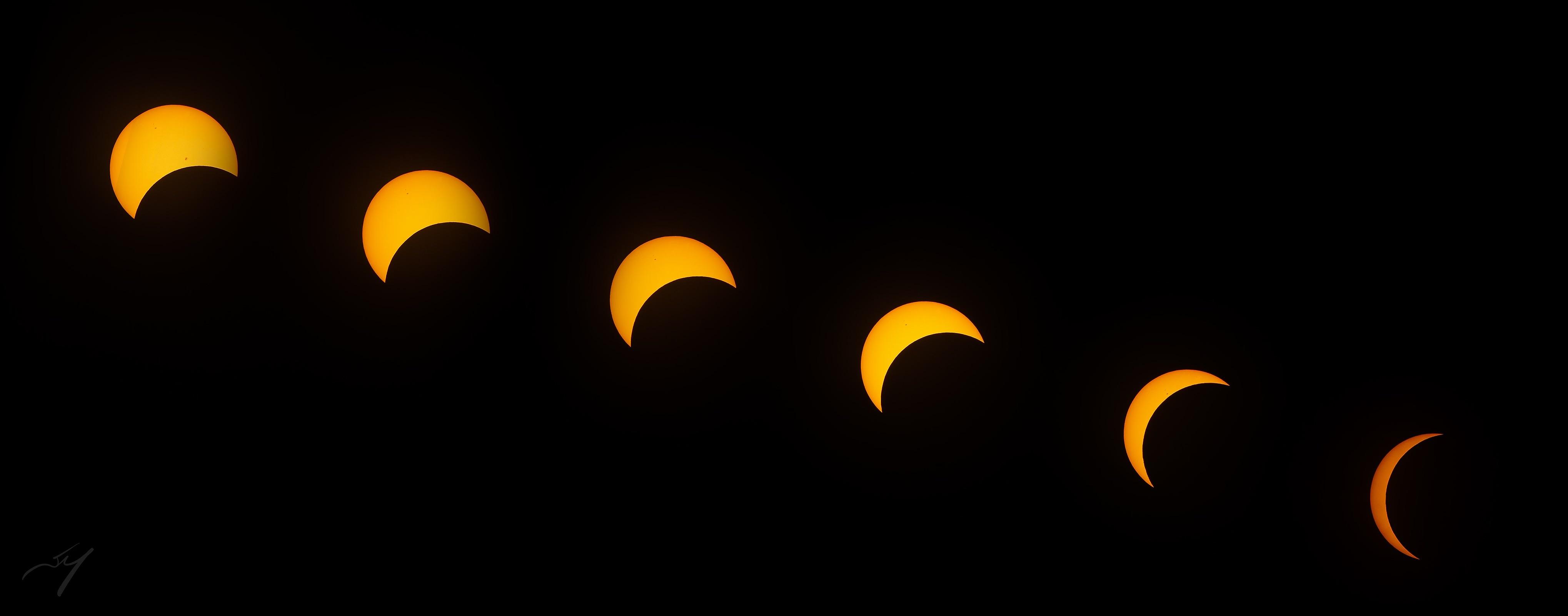 Partial eclipse from Virginia (with bonus clouds and crescent colander shadows) | Scrolller