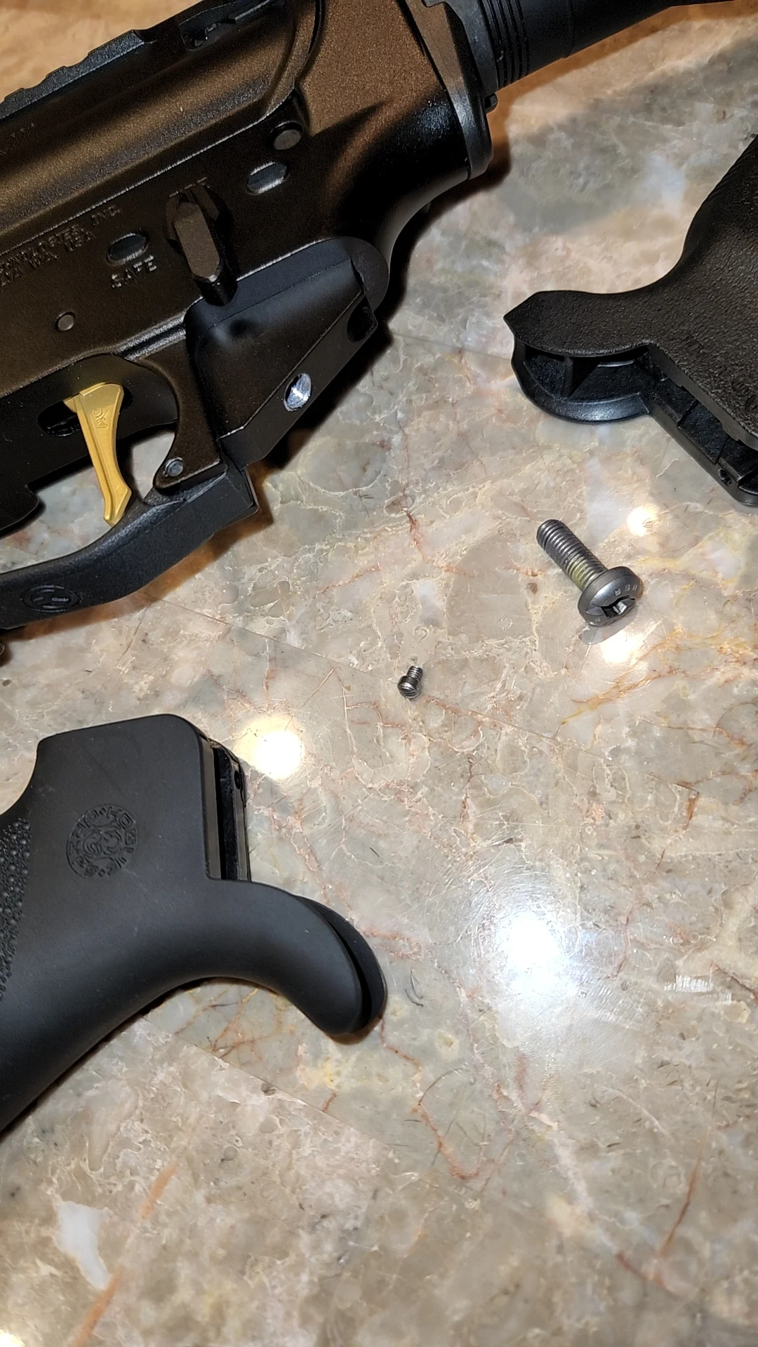what is this tiny screw for I was trying to add a new grip and it fell out of nowhere | Scrolller