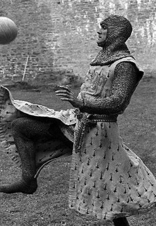 John Cleese taking a break on the set of Monty Python and the Holy Grail (1975) | Scrolller