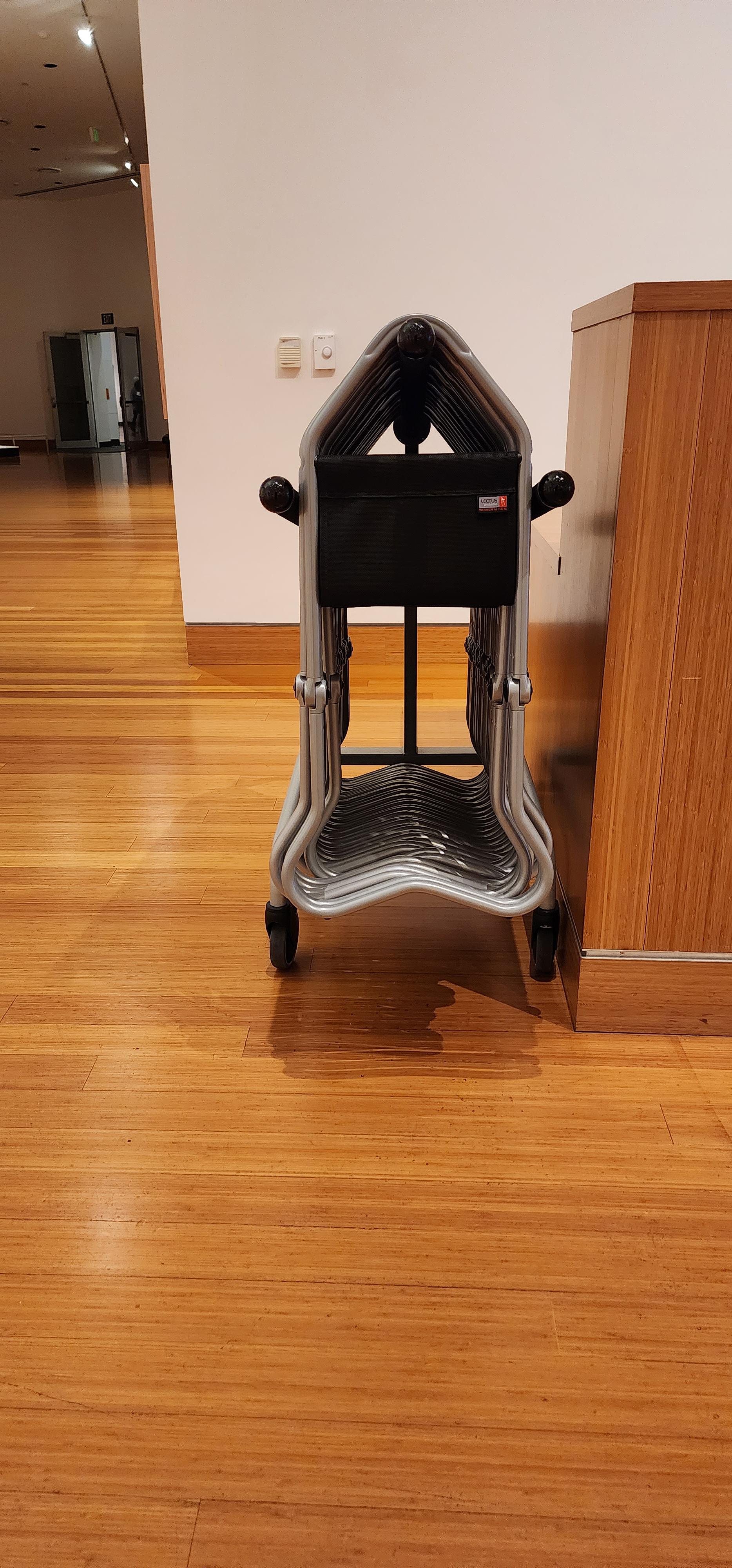 Folding chairs at an art museum. | Scrolller