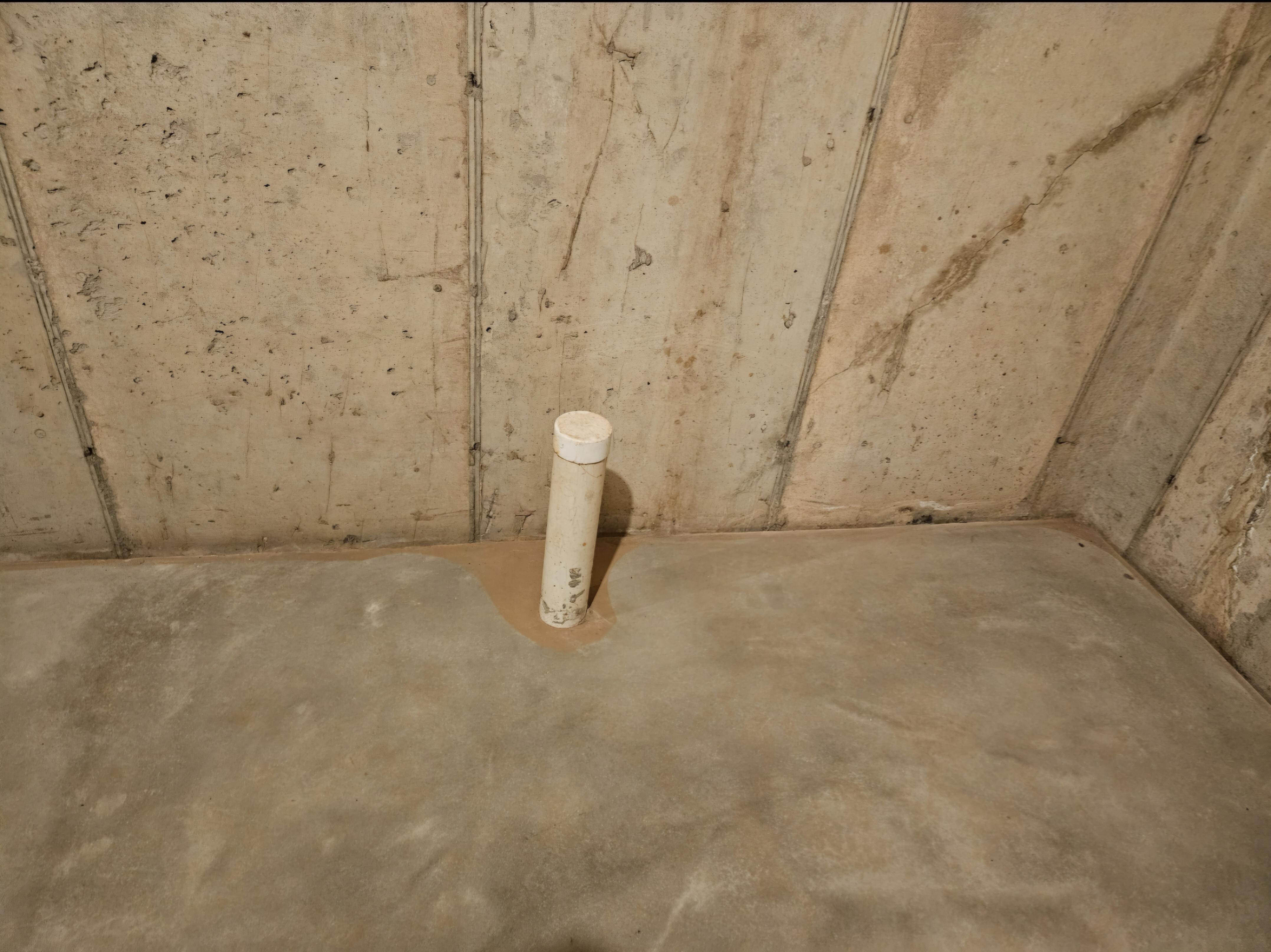 White PVC pipe in basement | Scrolller