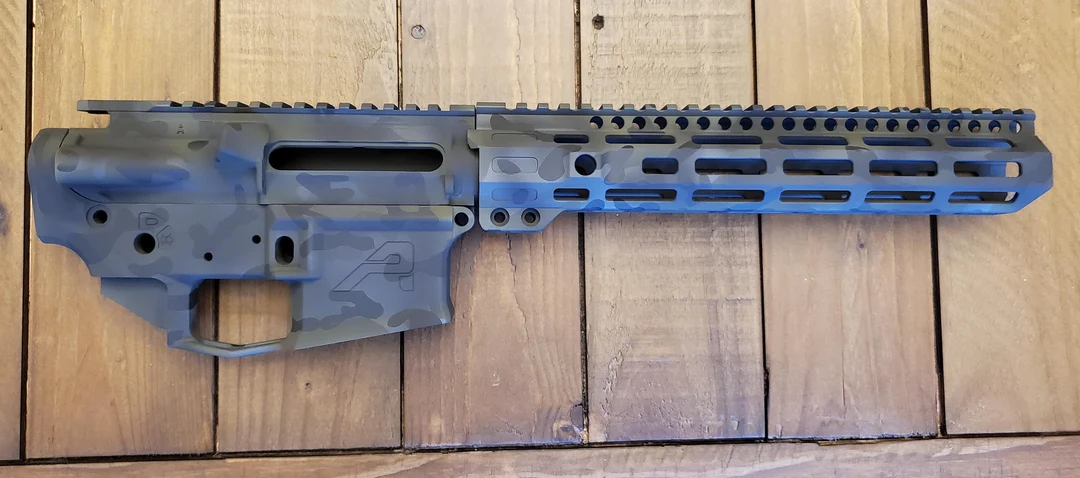Aero upper and lower with a Midwest combat rail in multicam black cerakote | Scrolller
