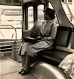 Rosa Parks sits at the front of a bus following the end of racial segregation by the transit ...
