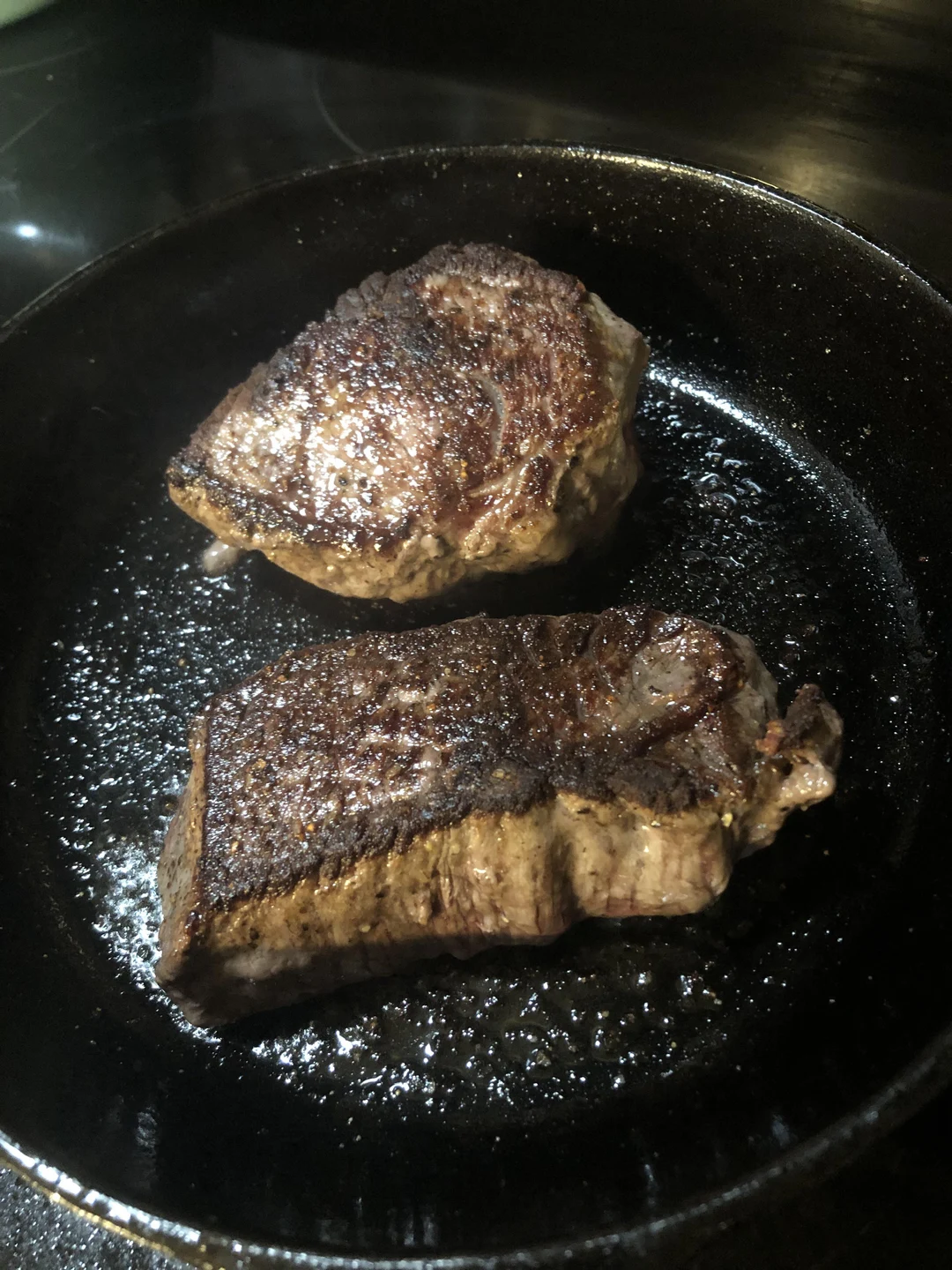 Got a pretty good sear on the first side of the rib-eye steaks. | Scrolller