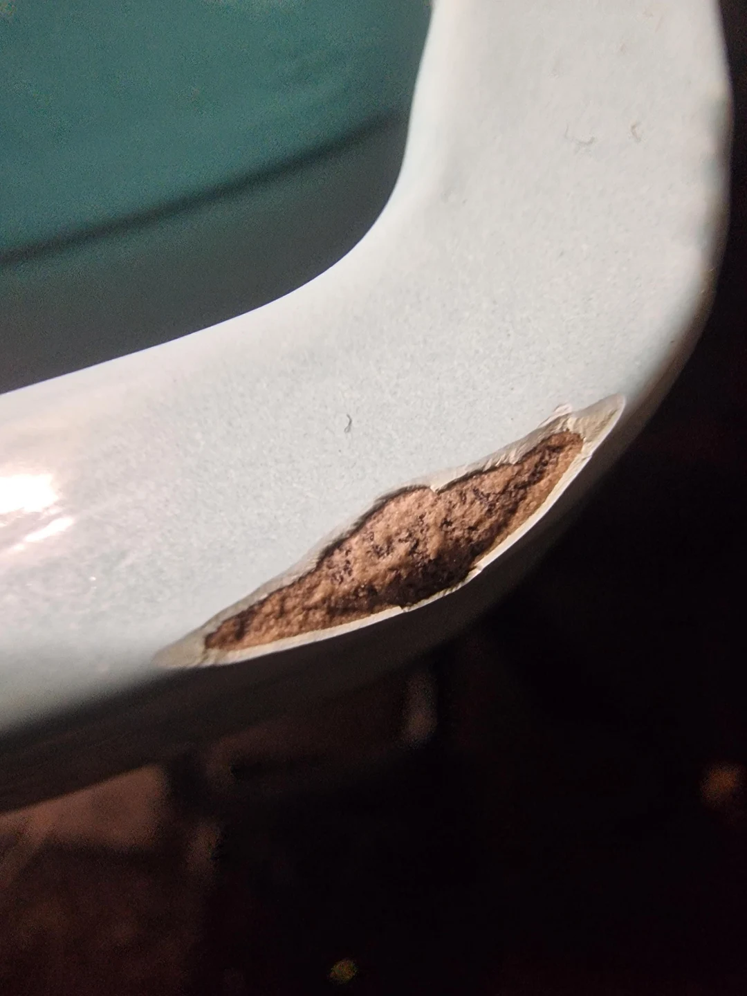 Dutch oven handle chipped, seeing weird material underneath? | Scrolller