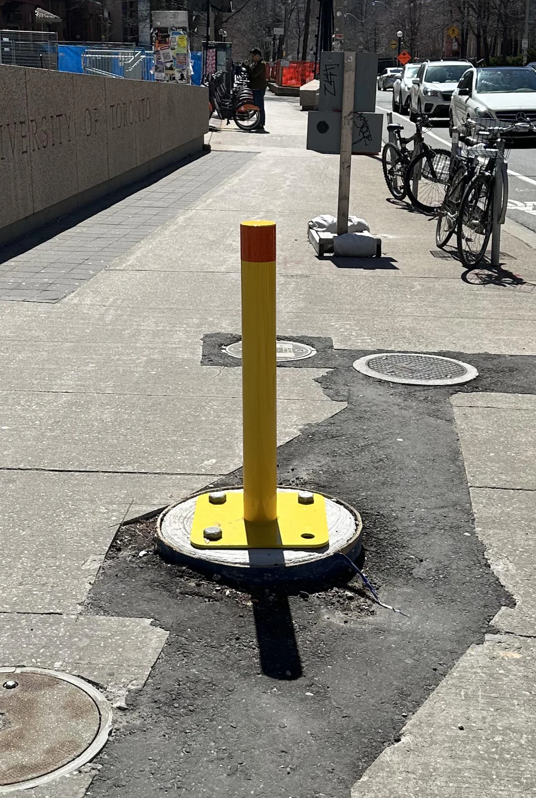 What are these poles in the middle of the sidewalk? | Scrolller
