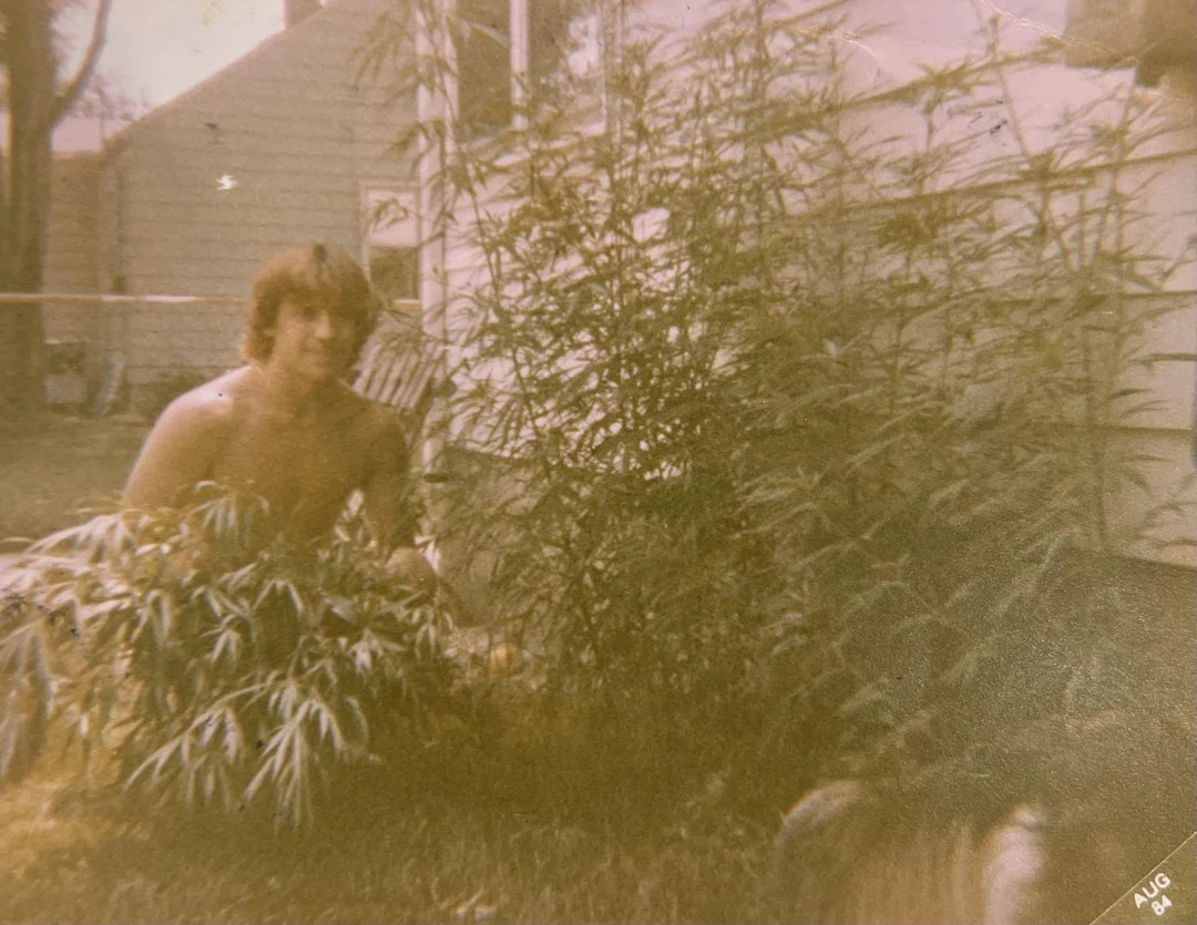 My dad, 20 years old at the time, posing with his pot. August 1984. | Scrolller