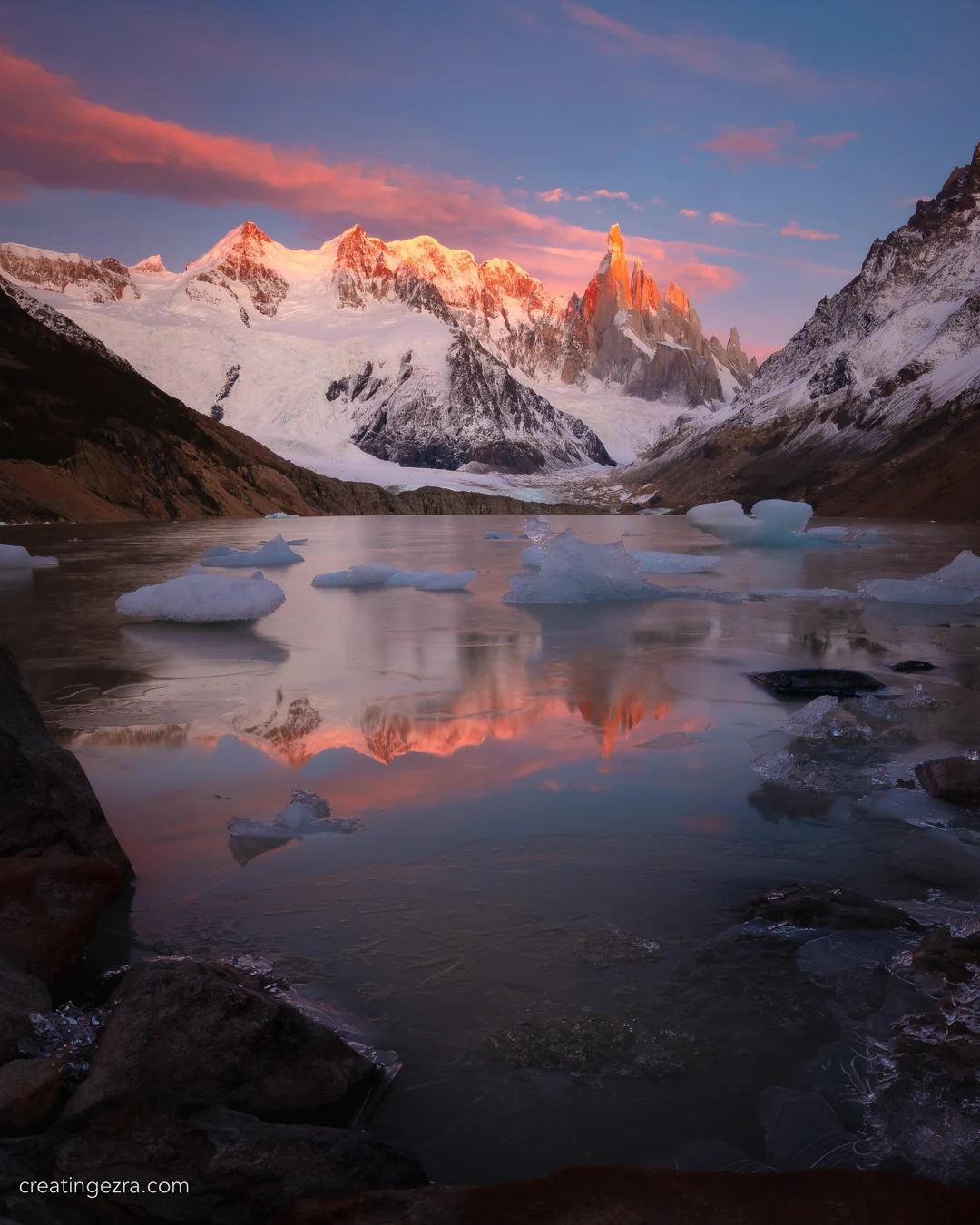 Cerro Torre, reflecting among the ice of Laguna Torre near El Chalten, Patagonia, Argentina ...