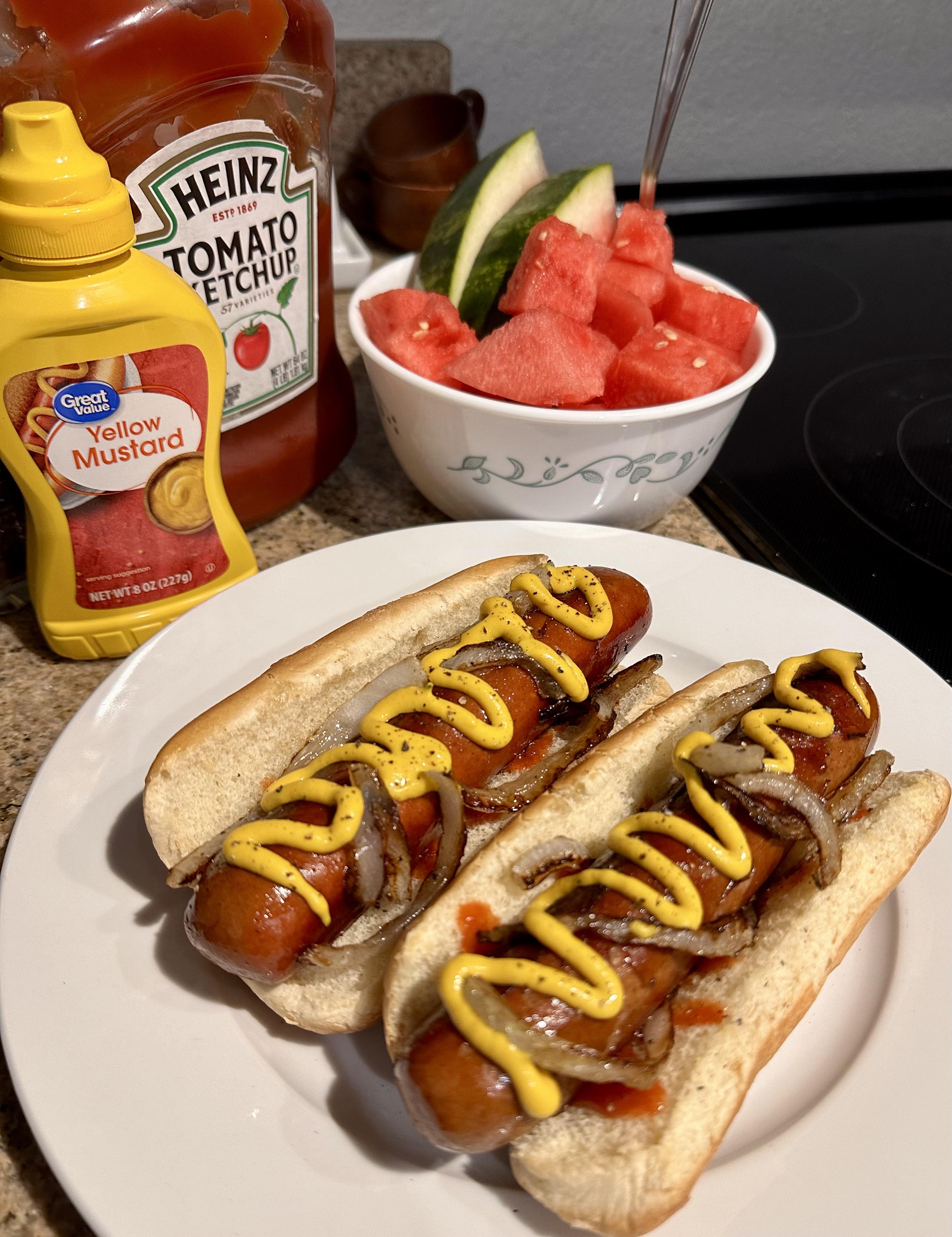 Classic summer meal - angus beef brats with onions and a side of ...