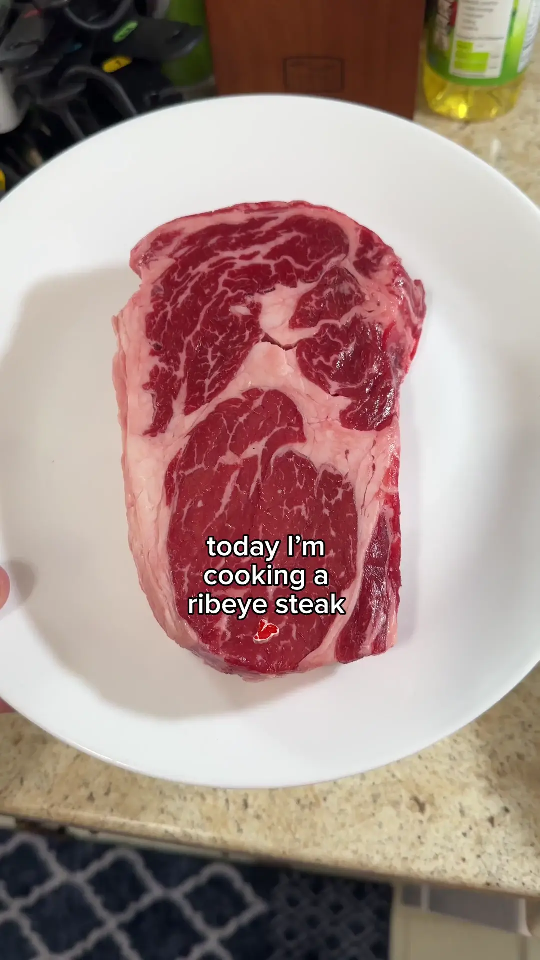 Cooking a ribeye steak in a stainless steel pan | Scrolller