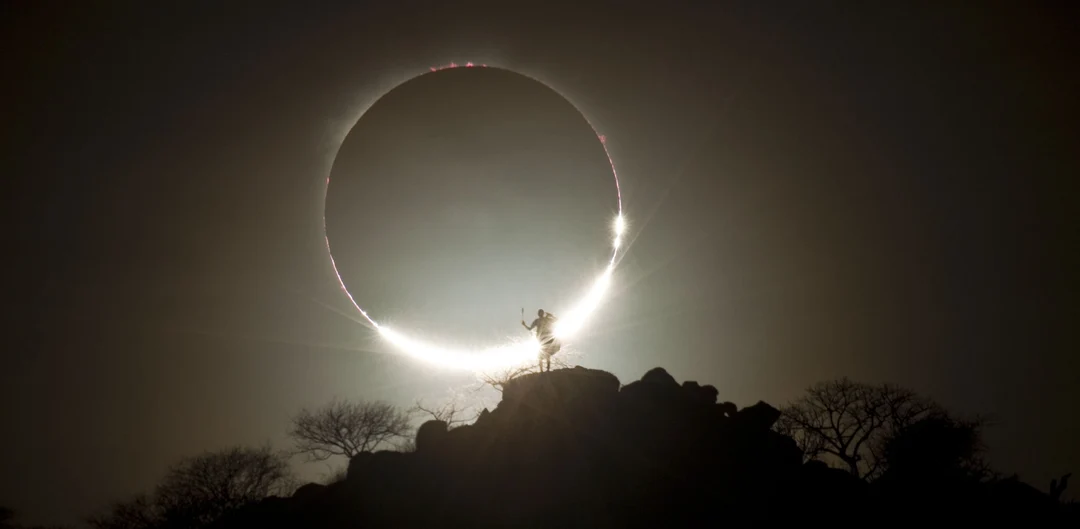 Hybrid Solar Eclipse and Maasai Warrior (Credit: Eugen Kamenew) | Scrolller