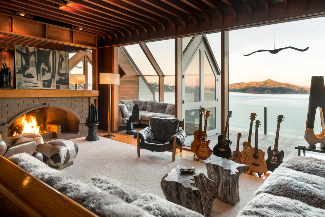 Living room with huge windows offering views of the bay in a Sausalito ...