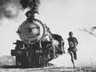 1968, Mathias Kanda, Olympic Marathon Runner keeps pace with a steam locomotive. | Scrolller