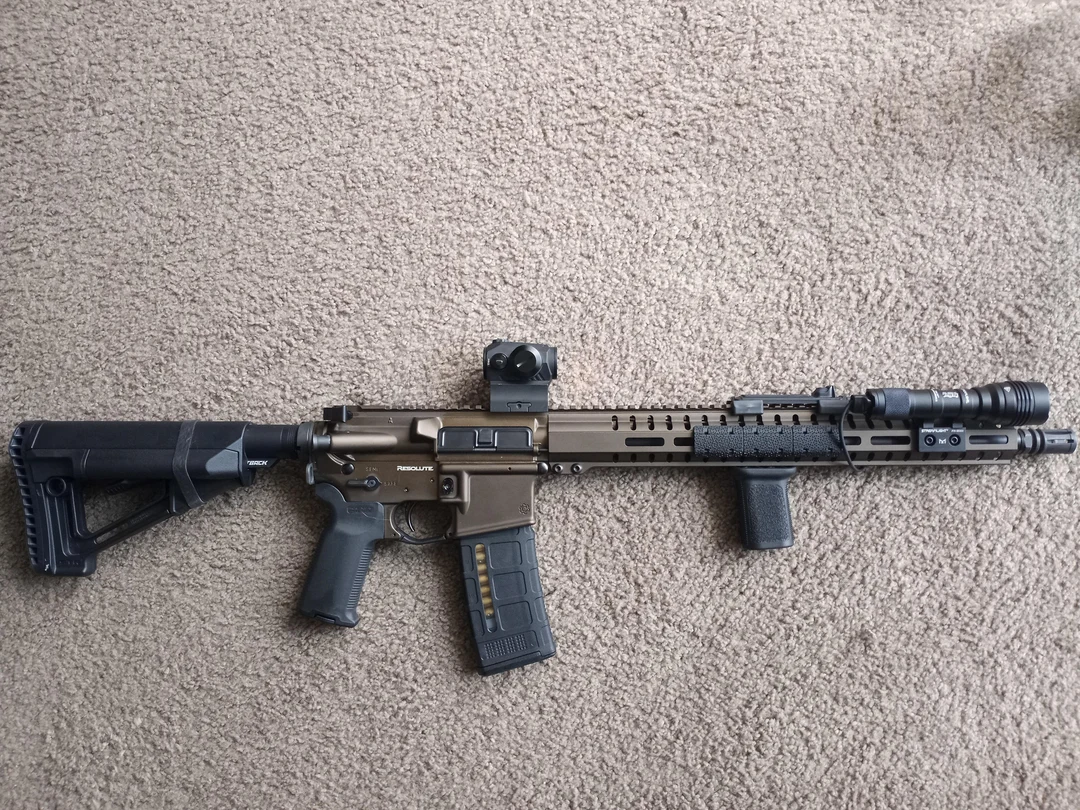 Added a light, swapped the grip, and switched to an a2 intead of a muzzle brake what y'all think ...