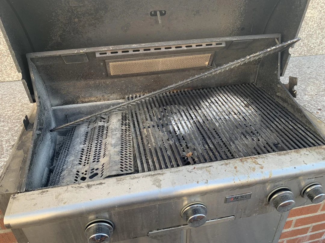 Some animal used charcoal in our community gas grill. Any way to clean this out? | Scrolller