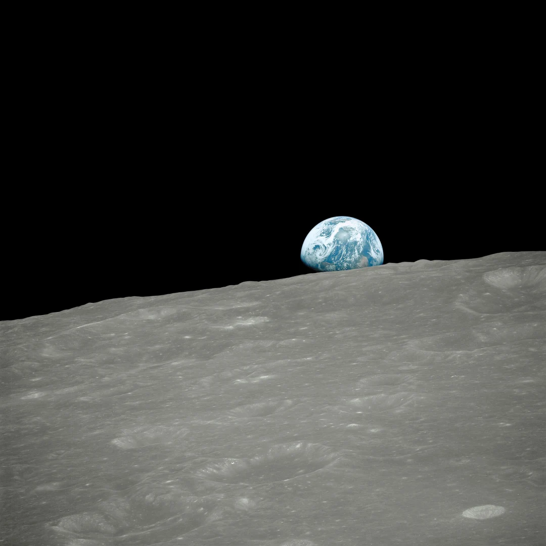 Colorized version of the first photograph of Earth rising from Lunar Orbit captured by a human ...