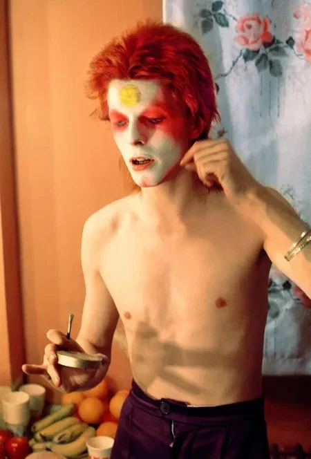 David Bowie becoming Ziggy Stardust, back stage, probably 1973. | Scrolller