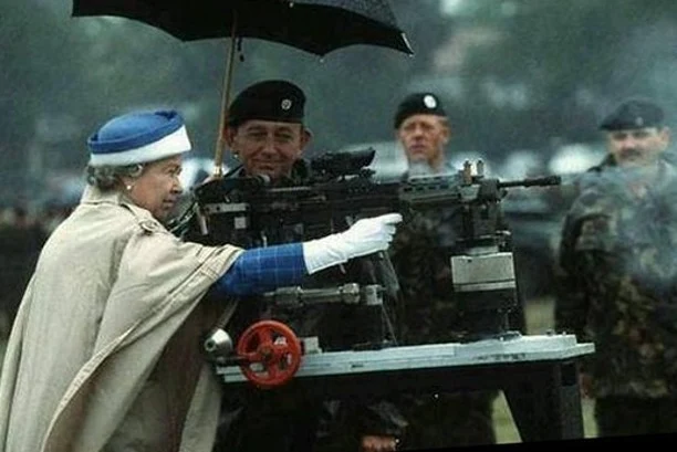 Elizabeth II firing a British L85 battle rifle in 1993. | Scrolller
