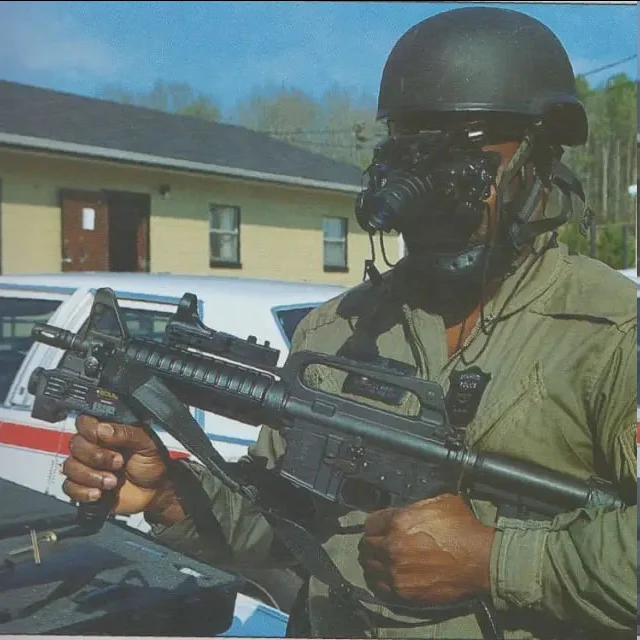 Interesting unknown foregrip in vintage SWAT (?) image. | Scrolller