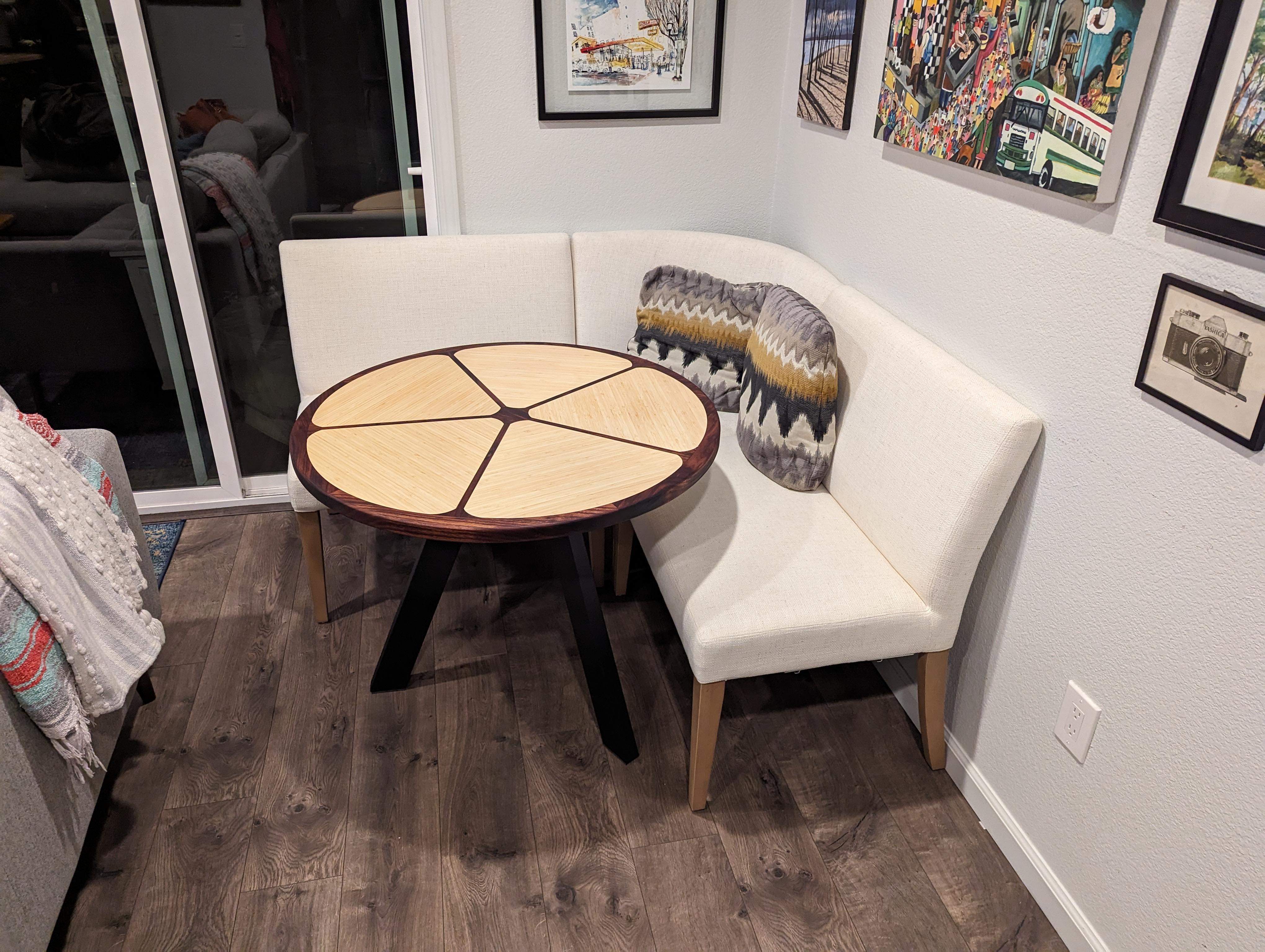 Bamboo and Black Acacia round dining table | Scrolller