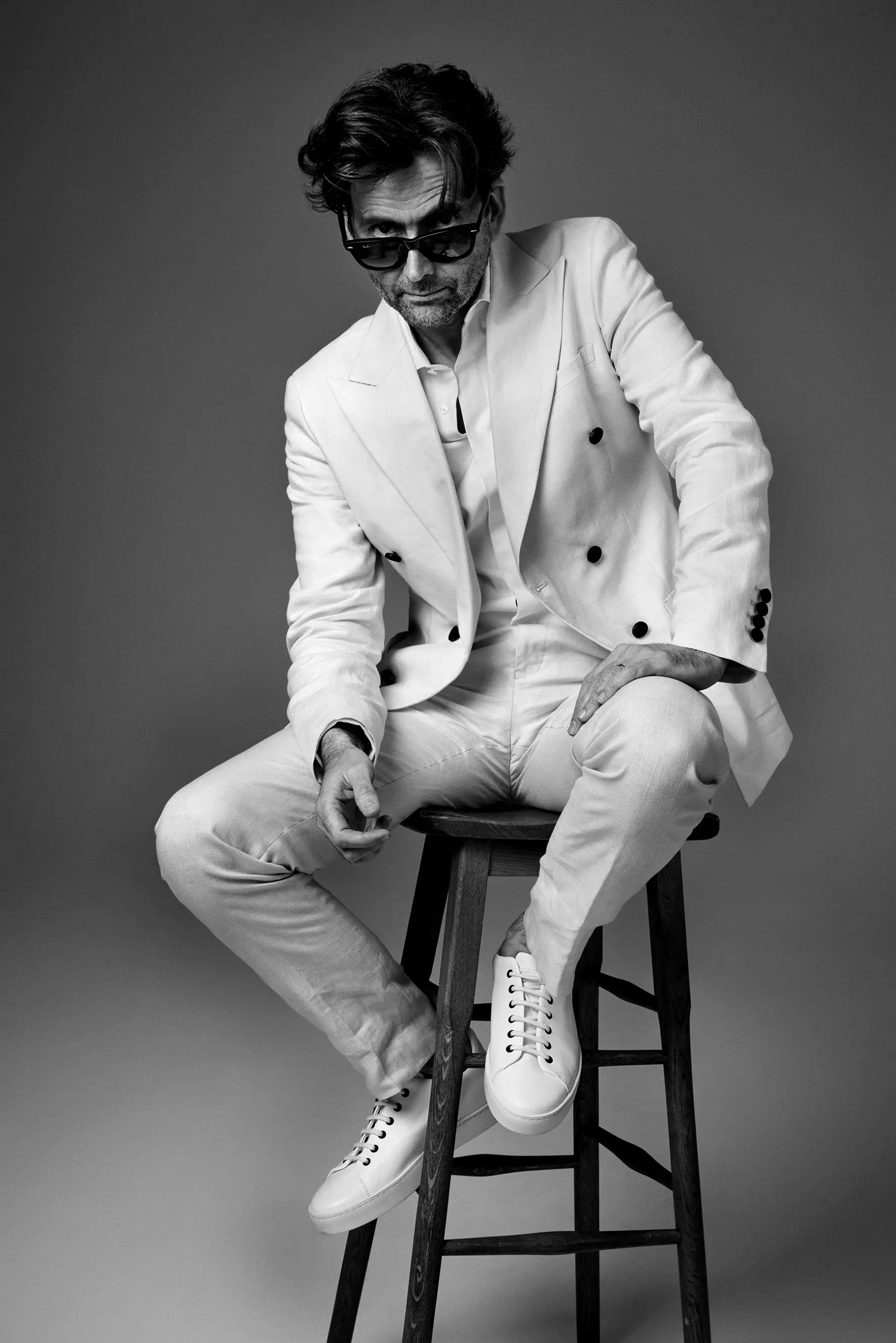 David with shades on stool from the London Times magazine, greyscaled ...