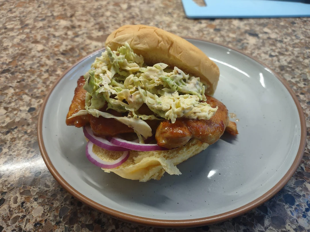 BBQ chicken thigh with red onions and a quick creamy mustard slaw. | Scrolller