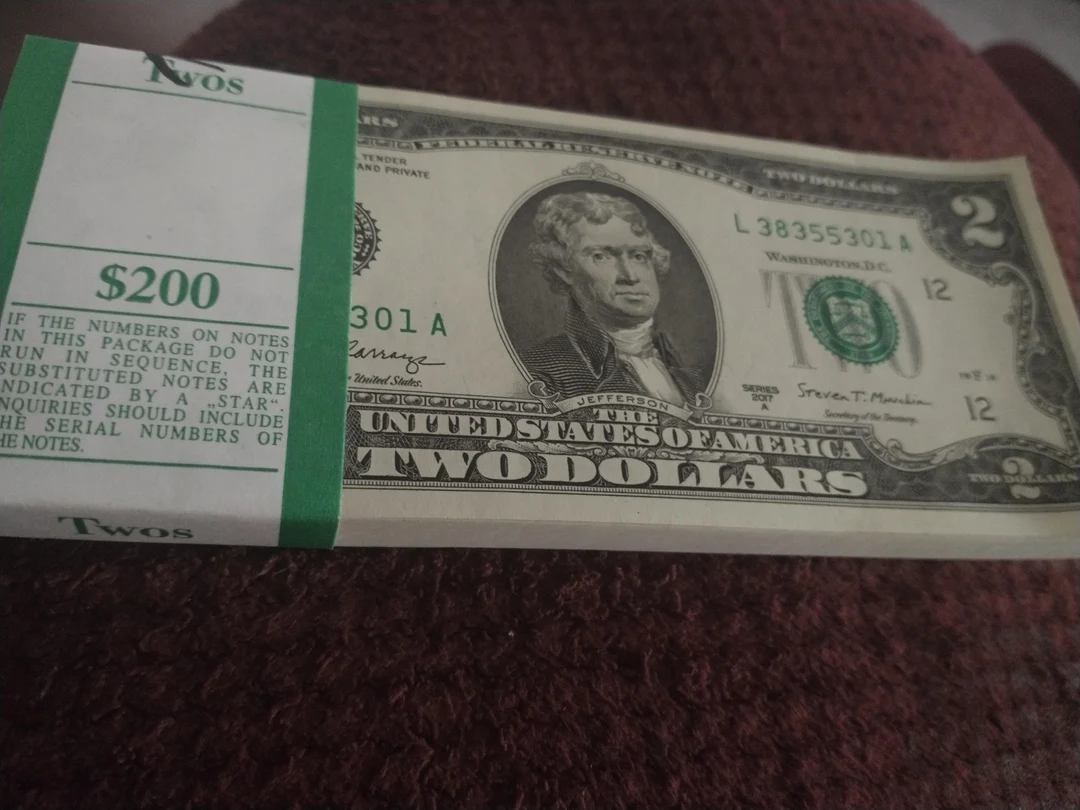 Stack of crispy $2 bills. | Scrolller