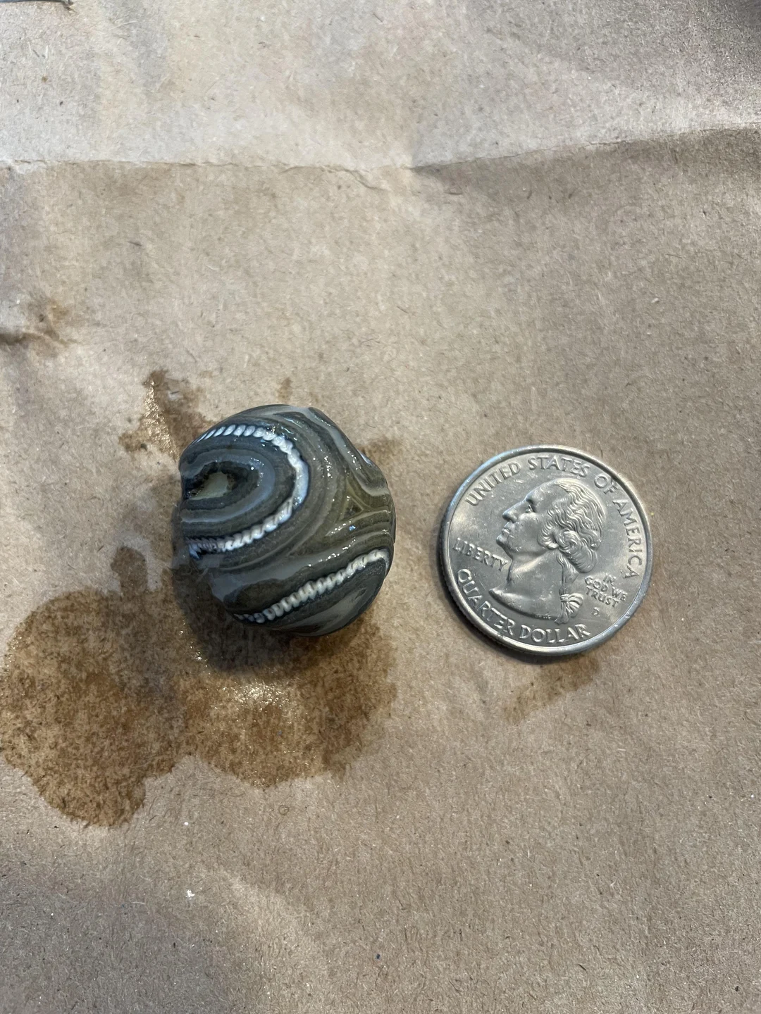 Here is a photo of the other side and a quarter for scale. | Scrolller