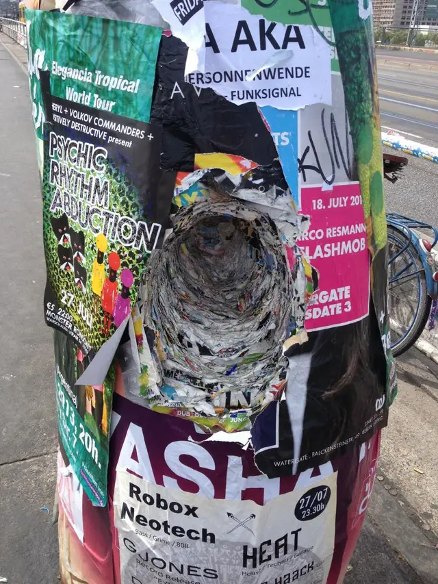 Old posters on a pole | Scrolller