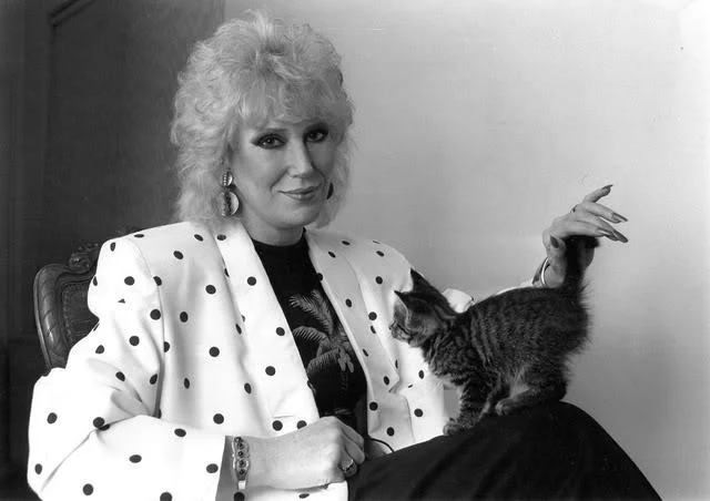 English Singer Dusty Springfield with a kitten, circa 1985 | Scrolller