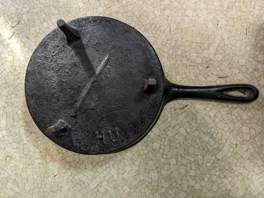 Trying to identify this gate marked cast iron with legs, any ideas? | Scrolller
