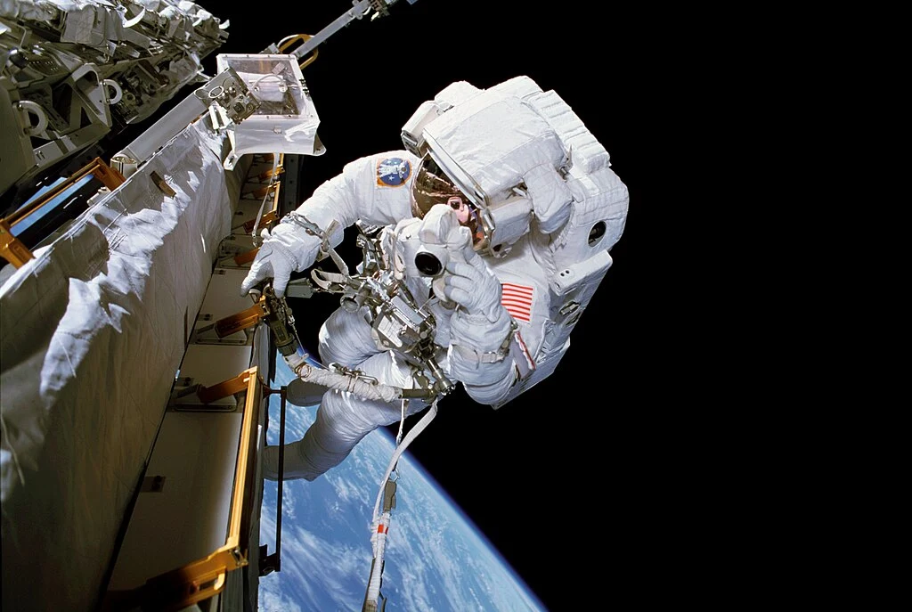On my first spacewalk, a colleague took a photo of me photographing him! | Scrolller