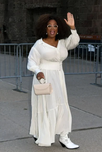 Oprah Winfrey wearing a white outfit | Scrolller