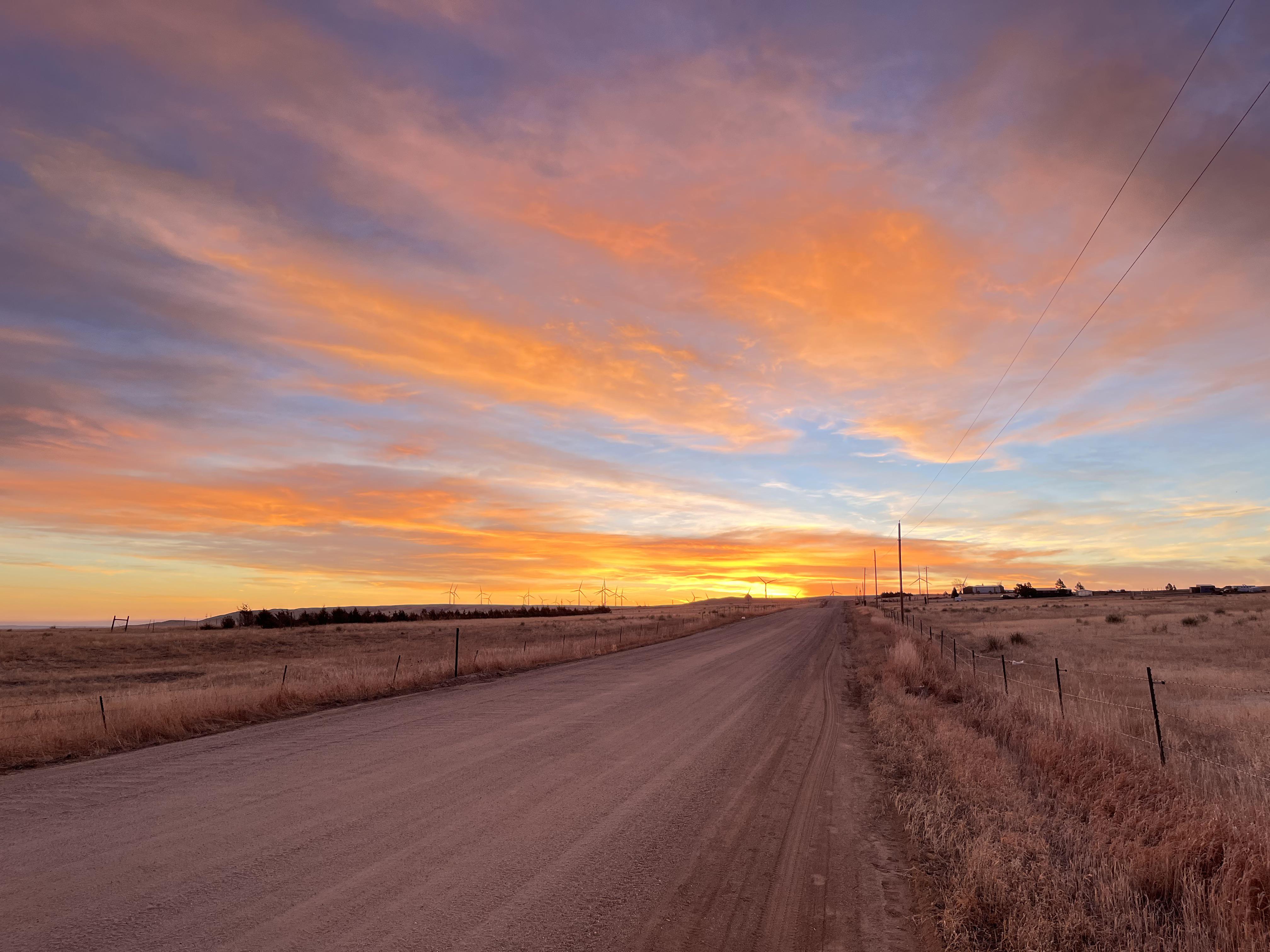 Sun rising while cruising another dirt road. | Scrolller