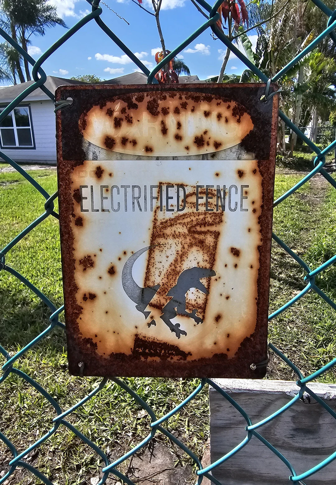 This sign on my neighbor's fence. | Scrolller