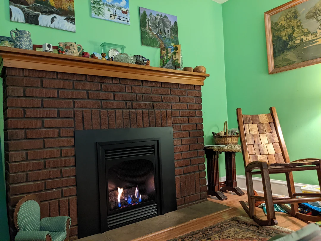 My parents cozy living room with their new fireplace & my mom's paintings | Scrolller