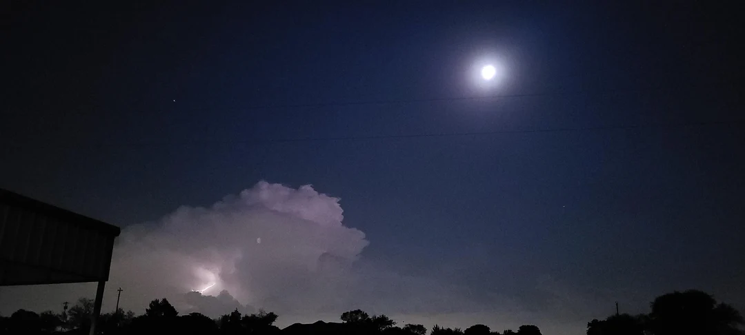 Saturn and The Moon with a distant lightning strike. | Scrolller