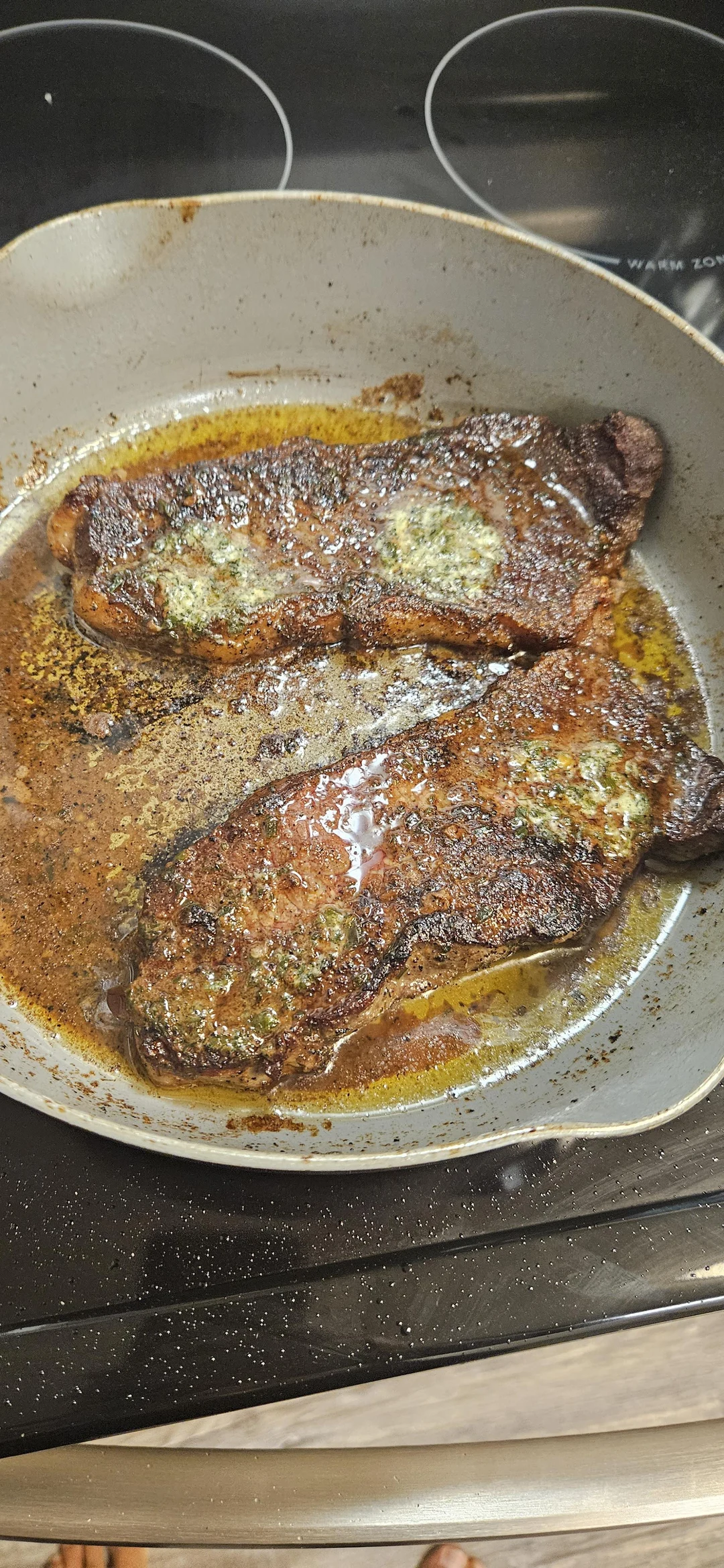 Garlic herb compound butter strip steaks | Scrolller