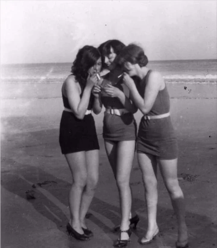 Flappers having a smoke on the Atlantic City Beach, 1927 | Scrolller
