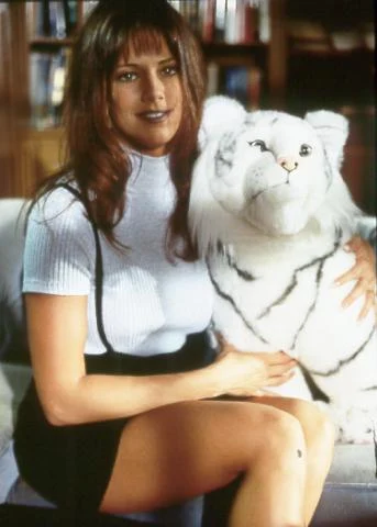 Racquel Darrian looking sweet and innocent posing with a stuffed animal. | Scrolller
