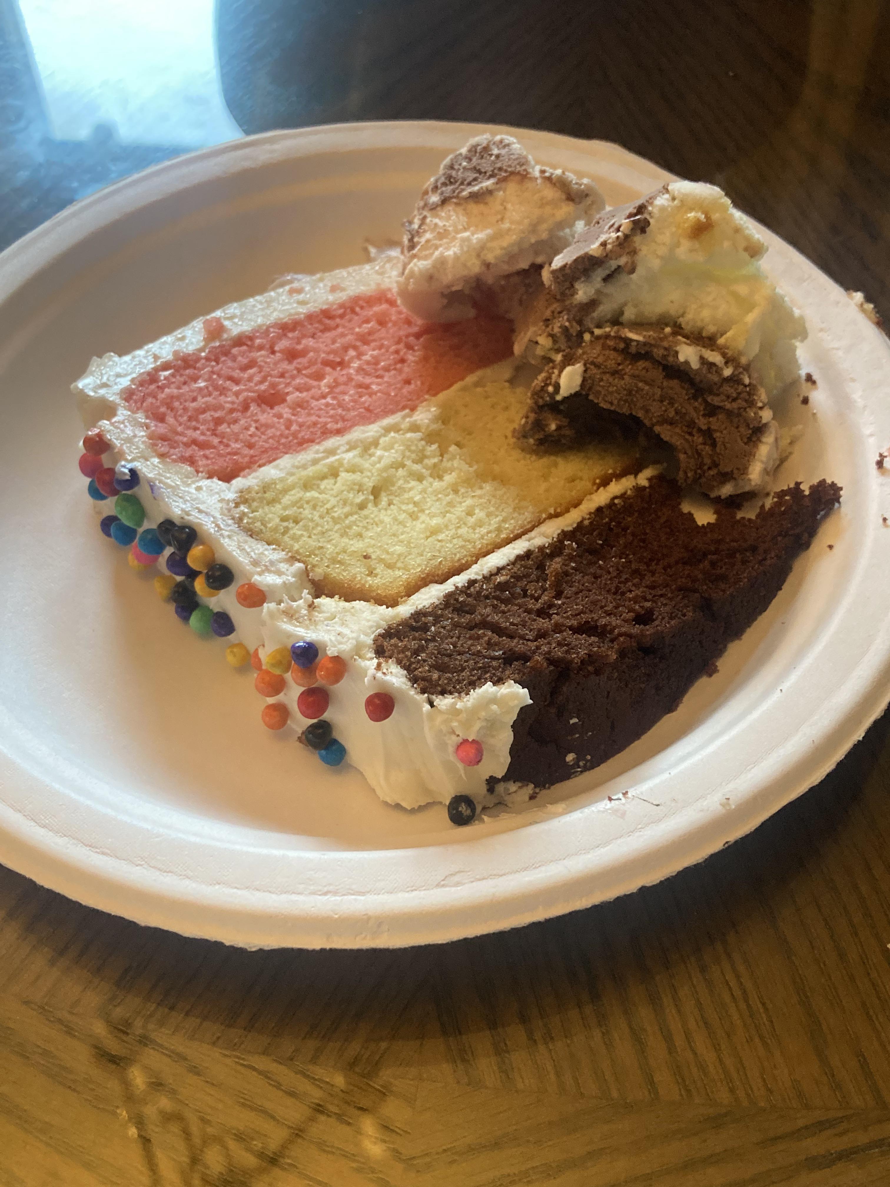 A cake I made for my birthday with three different flavors. Strawberry, vanilla, and chocolate ...