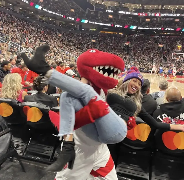 Busty blonde at raptor game | Scrolller