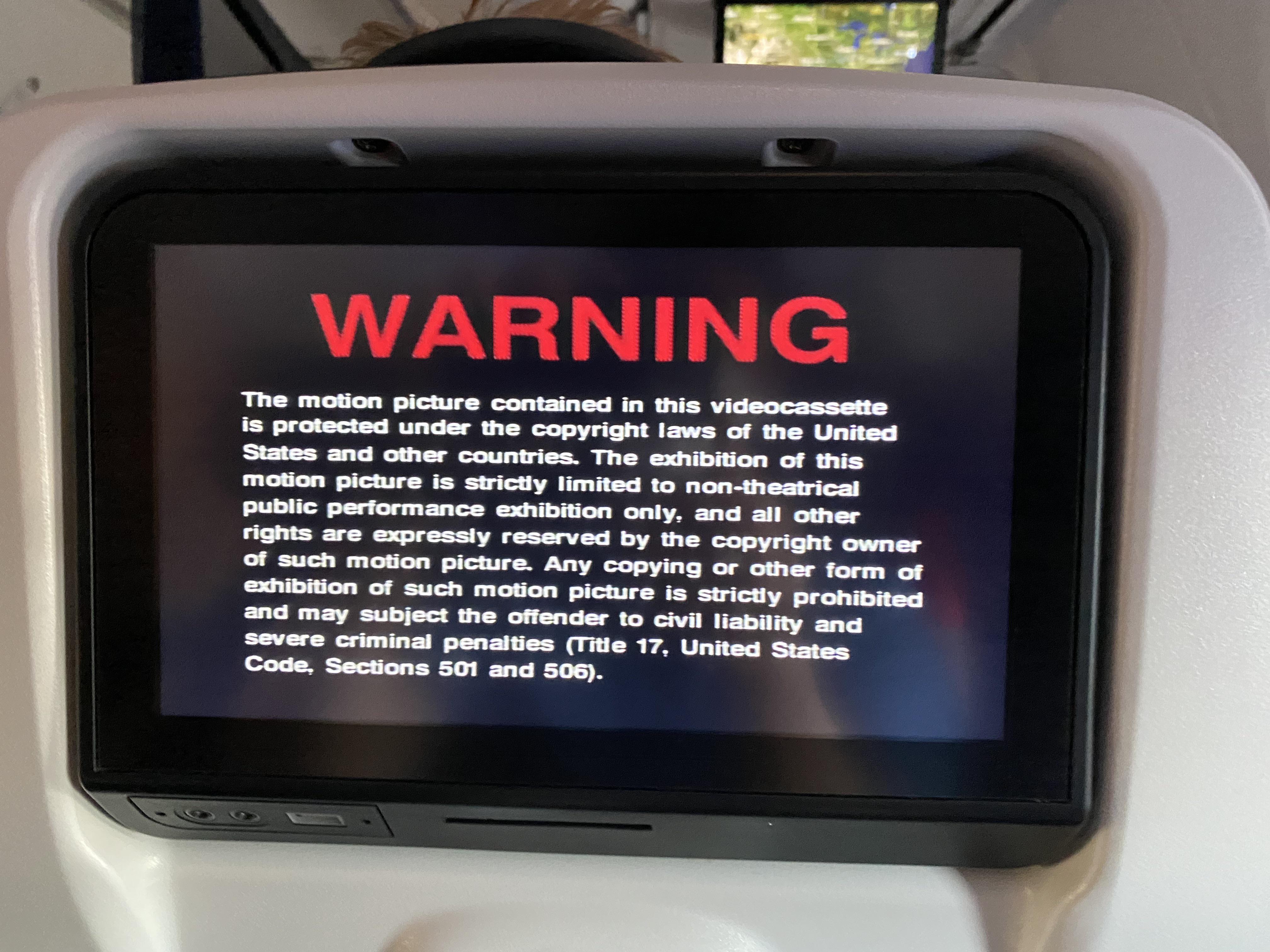 My in-flight movie still has the VHS copyright warning | Scrolller