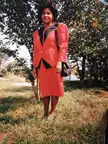 My mom serving in red with a long strap purse, Cameroon, mid-90's. | Scrolller