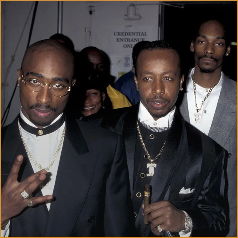 Tupac Shakur, MC Hammer and Snoop Dogg at the 23rd Annual American Music Awards in 1996 | Scrolller