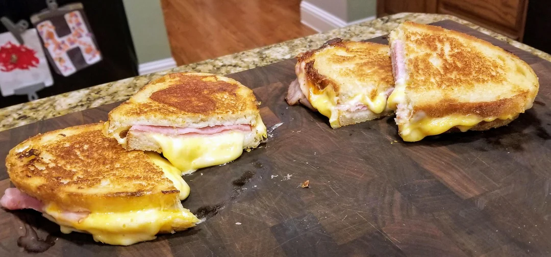 Ham, muenster cheese, and American cheese sandwiches on homemade sourdough. | Scrolller